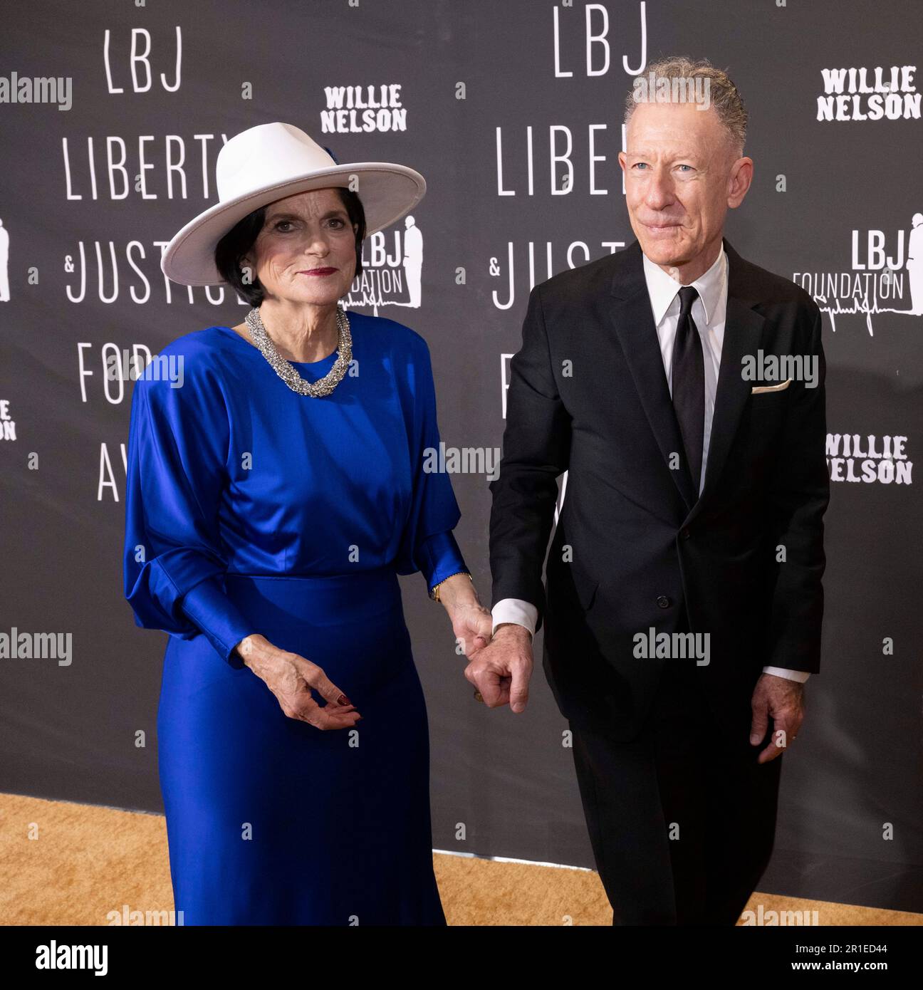 LUCI BAINES JOHNSON and Texas musician LYLE LOVETT walk the red carpet ...
