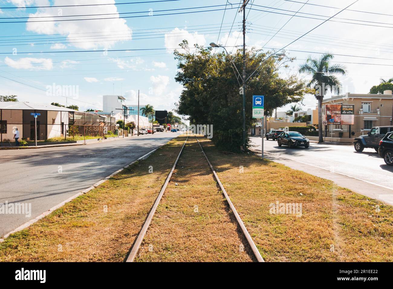 old train tracks run down a highway median strip in Merida, Mexico ...
