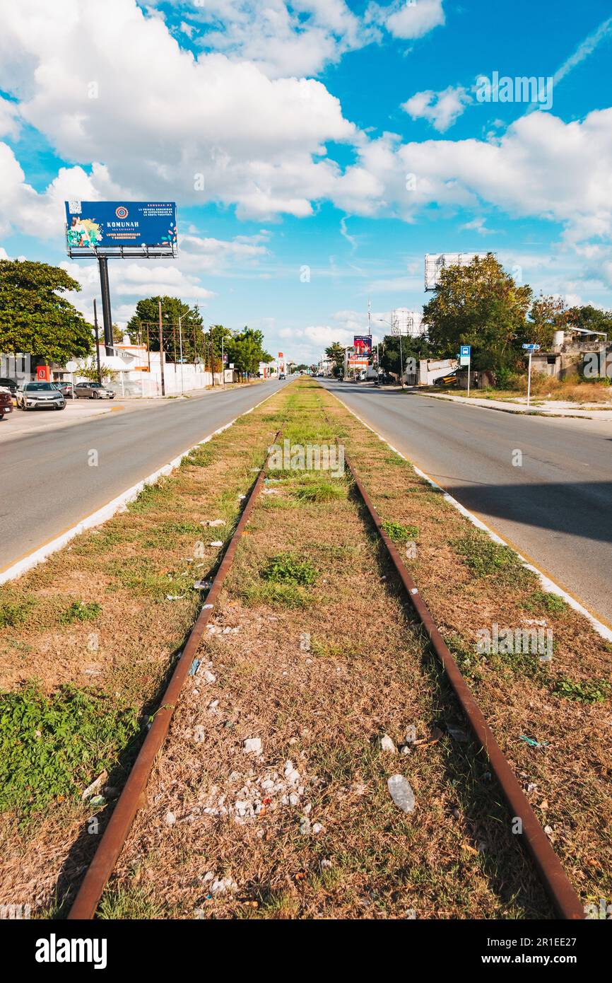 old train tracks run down a highway median strip in Merida, Mexico ...