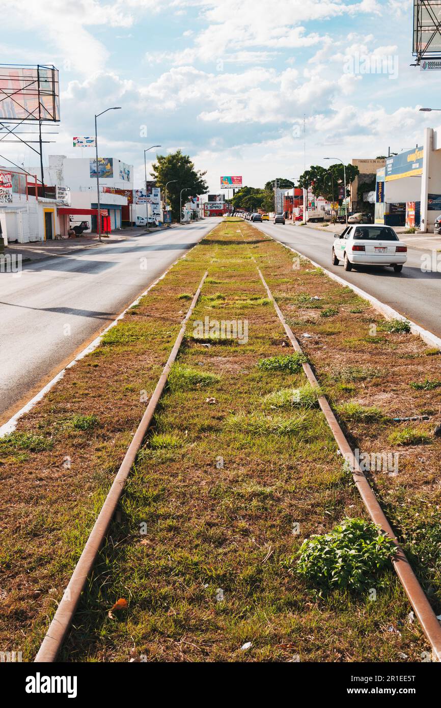 old train tracks run down a highway median strip in Merida, Mexico ...