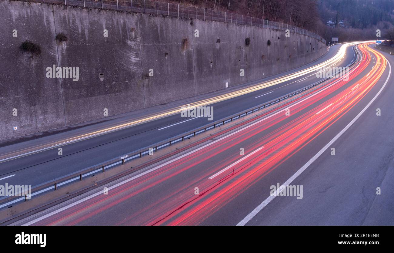 Light trail of white Headlights and red Backlights of cars on highway ...