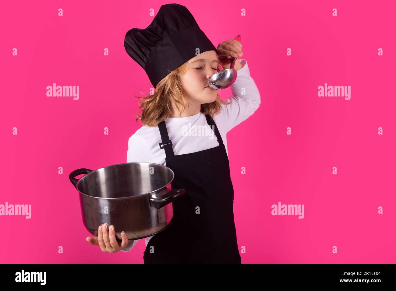 Kid cook with cooking pot and ladle. Portrait of little child in ...
