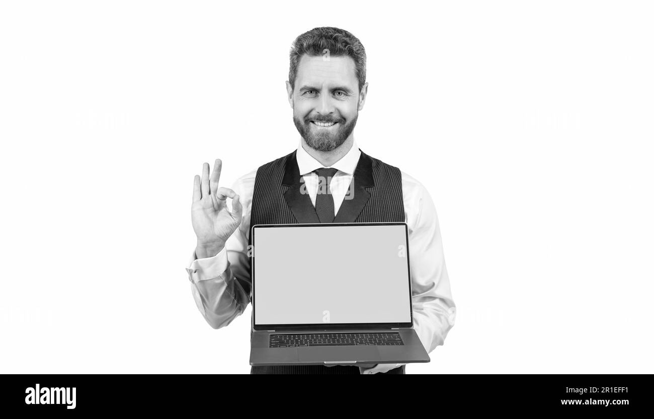 happy man presenting product of pc with green screen for copy space ...