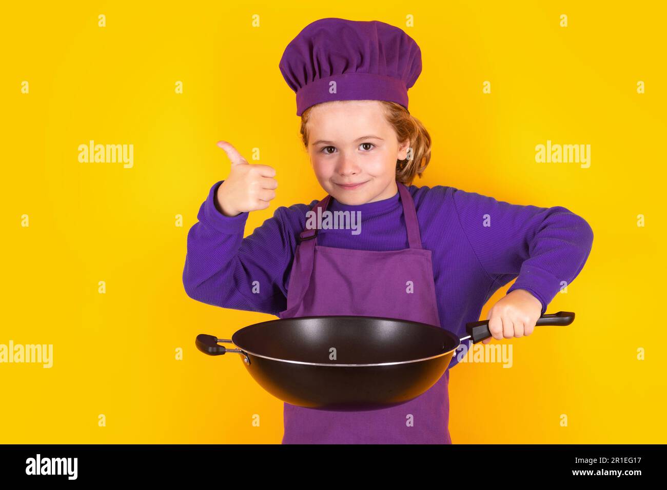 Kid boy chef cook with cooking pan. Child chef cook. Child wearing ...
