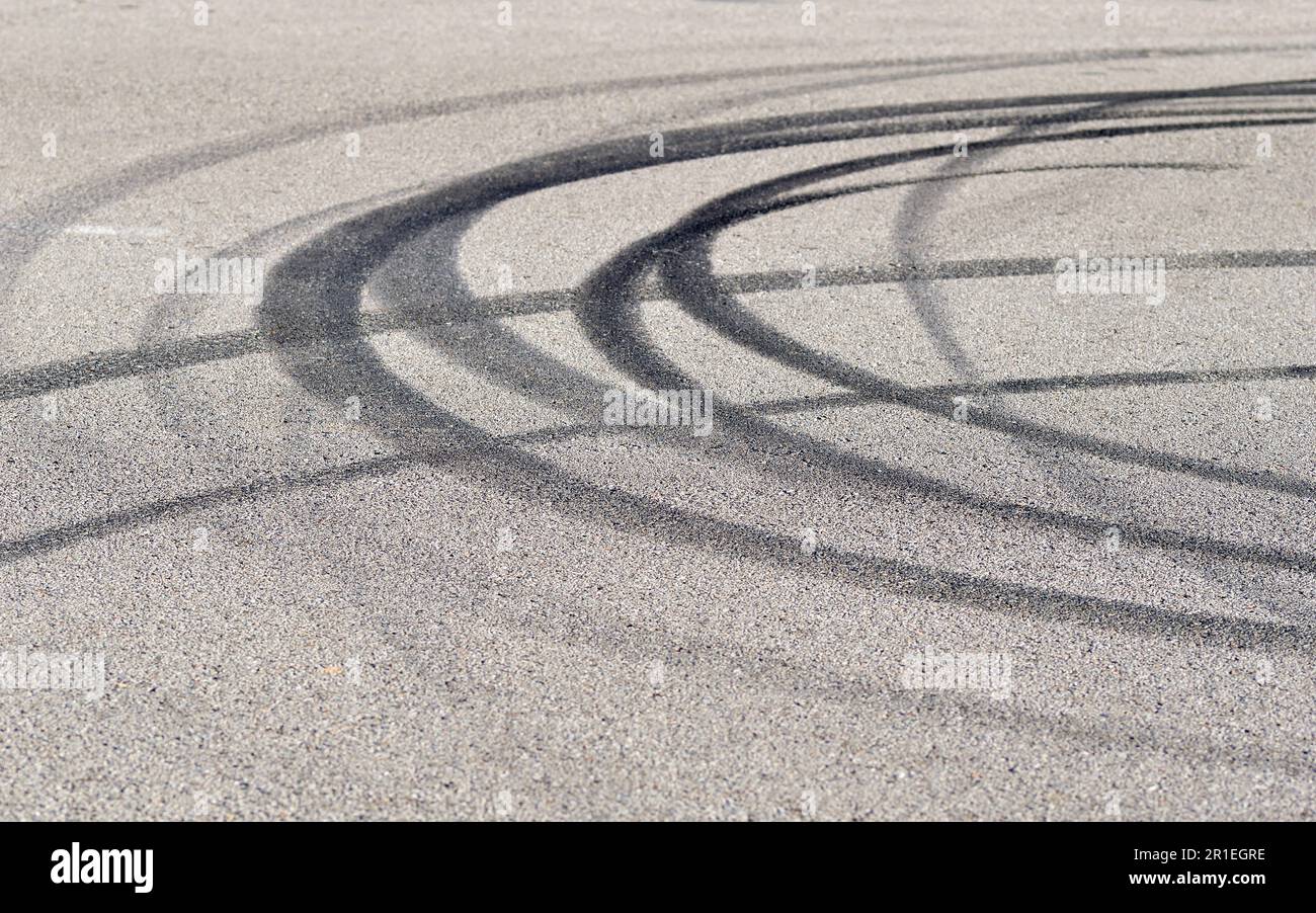 Close-up of several tire skid marks on asphalt Stock Photo - Alamy