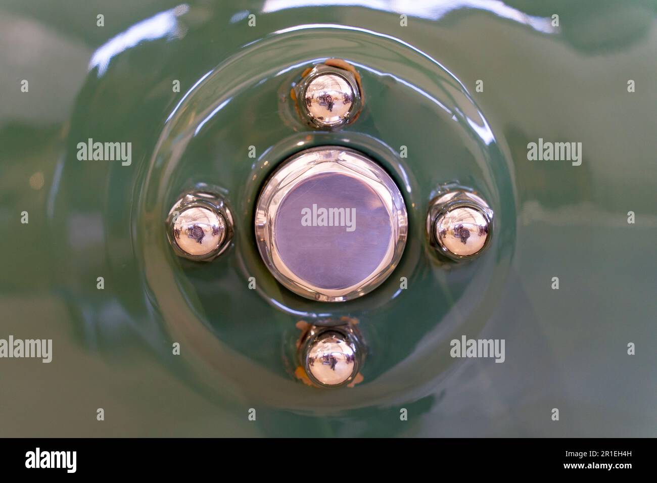 Oldtimer green car metal wheel bearing bolts Stock Photo - Alamy