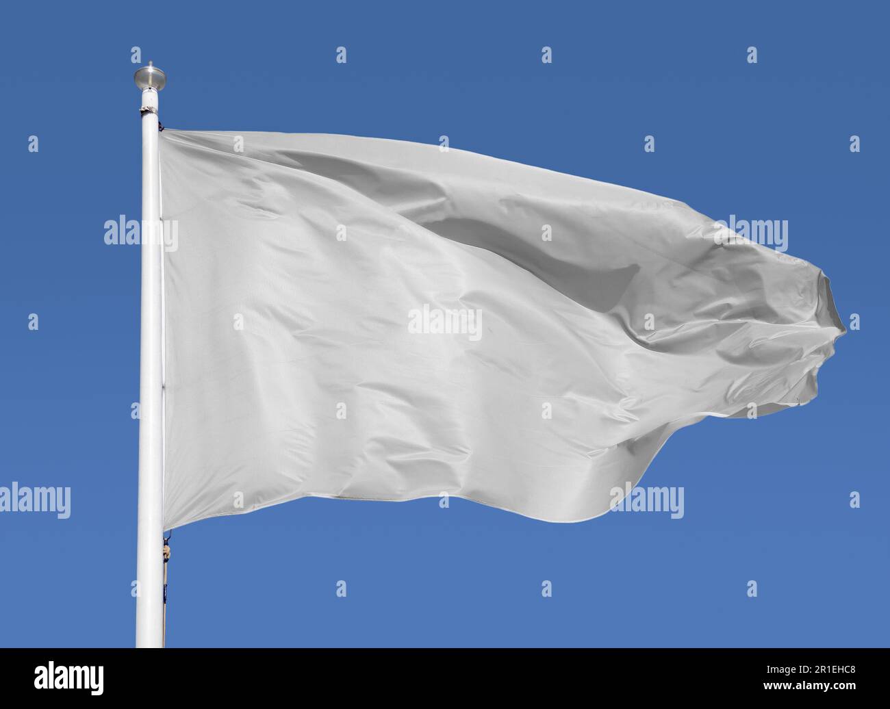 Empty white clear flag waving against clean blue sky and close up ...