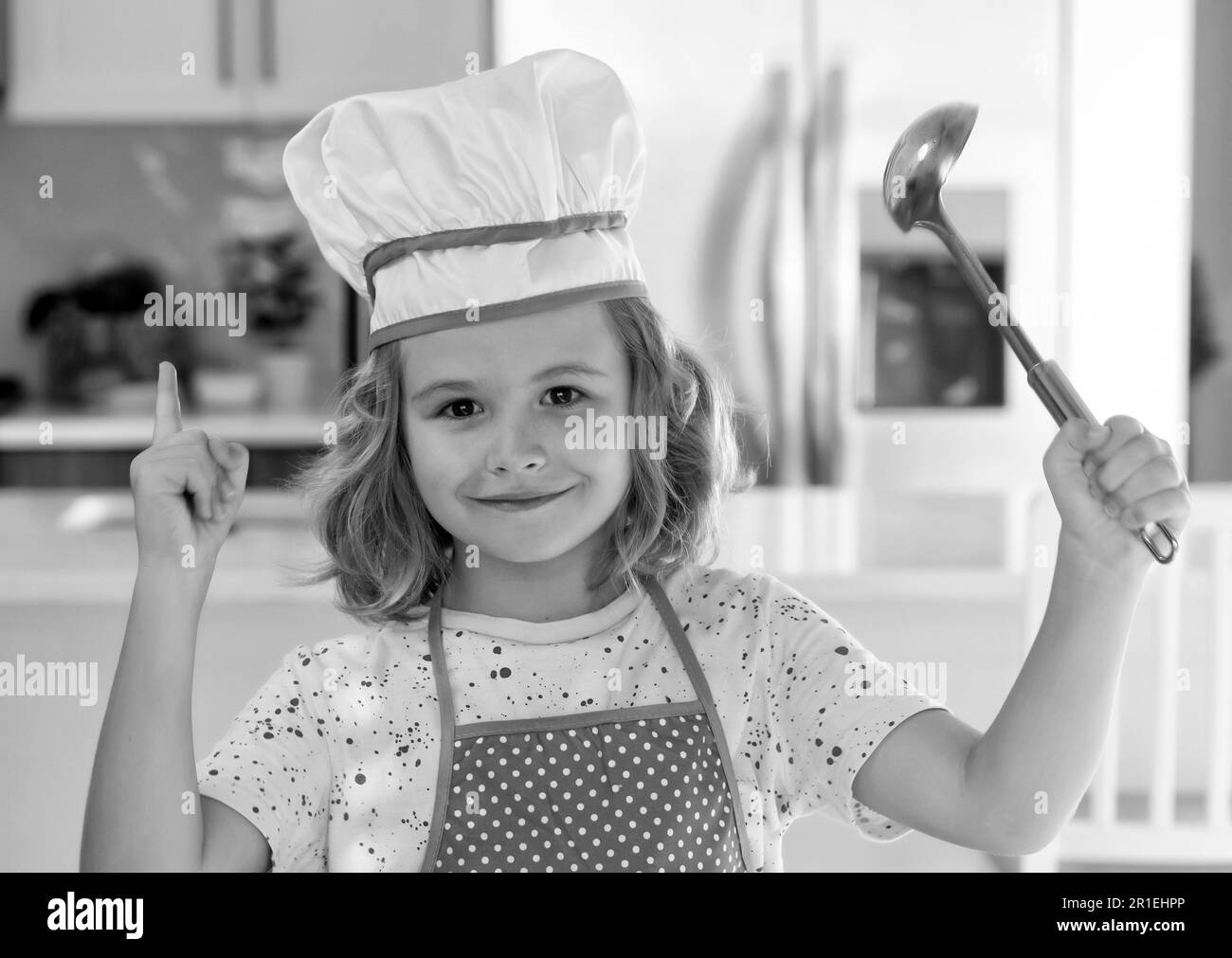 Children cooking in the kitchen. Funny kid chef cook cookery at kitchen ...