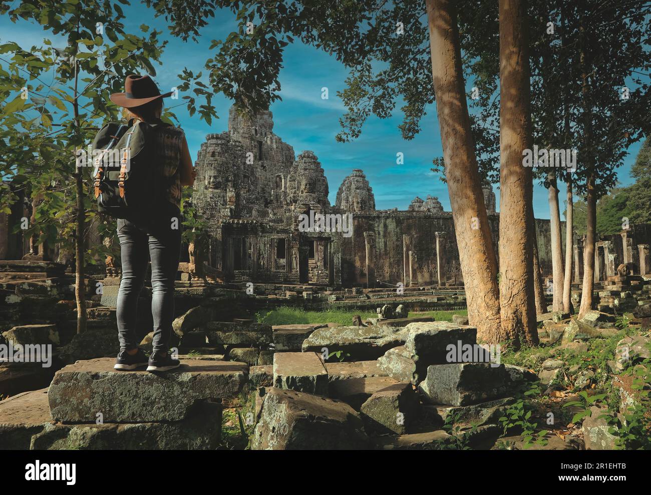 Soft focus on tourist standing in front of Angkor Wat temple in Siem ...