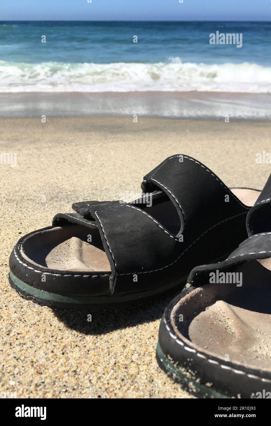 Sandals in the sand at Carlsbad State Bach in Carlsbad, California, USA ...