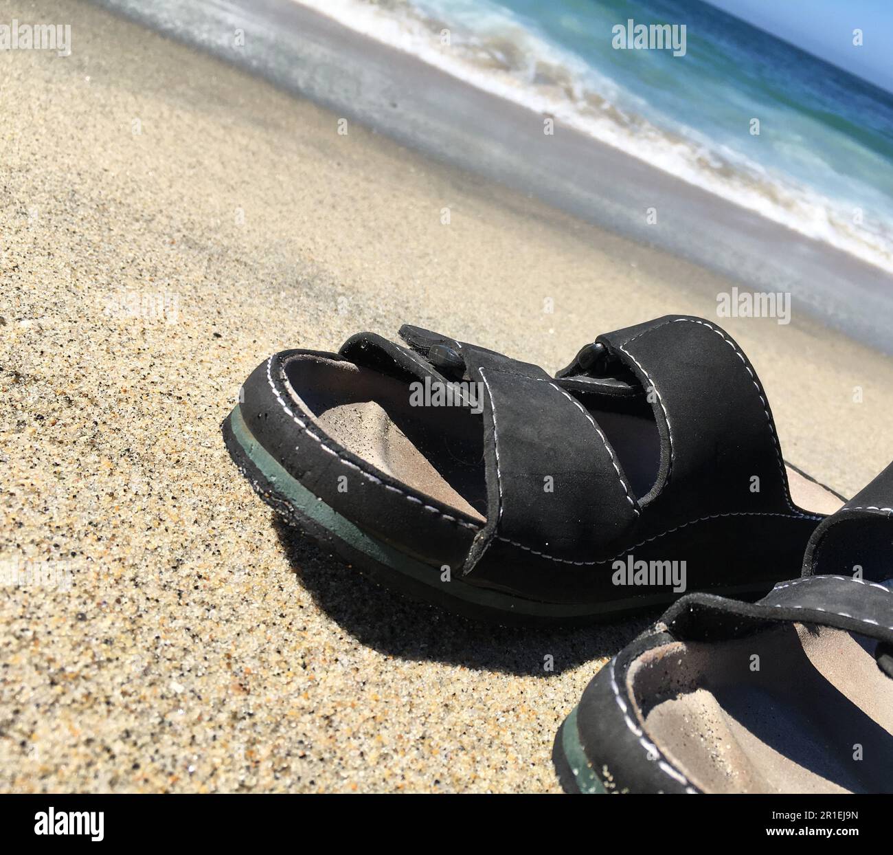Sandals in the sand at Carlsbad State Bach in Carlsbad, California, USA ...