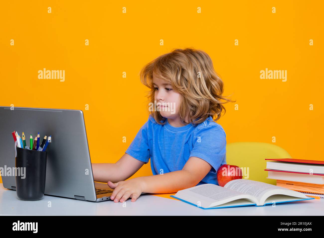 School child using laptop computer. School kid student learning, study ...