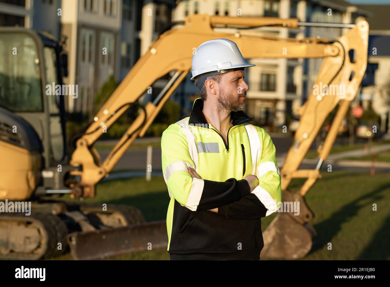 Worker with bulldozer on site construction. Man excavator worker ...