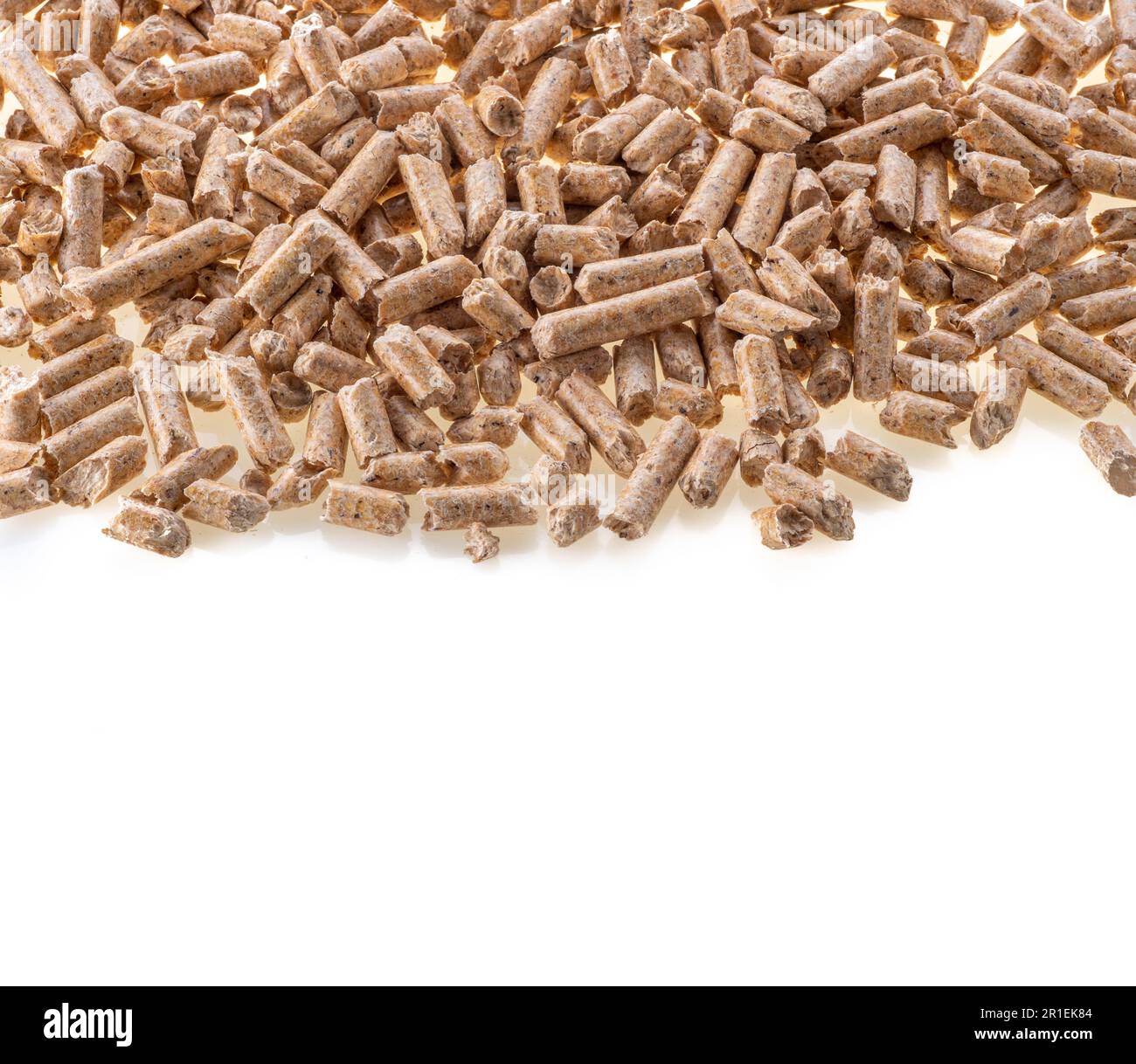 Wood pellets; full frame close up in top view, on white background ...