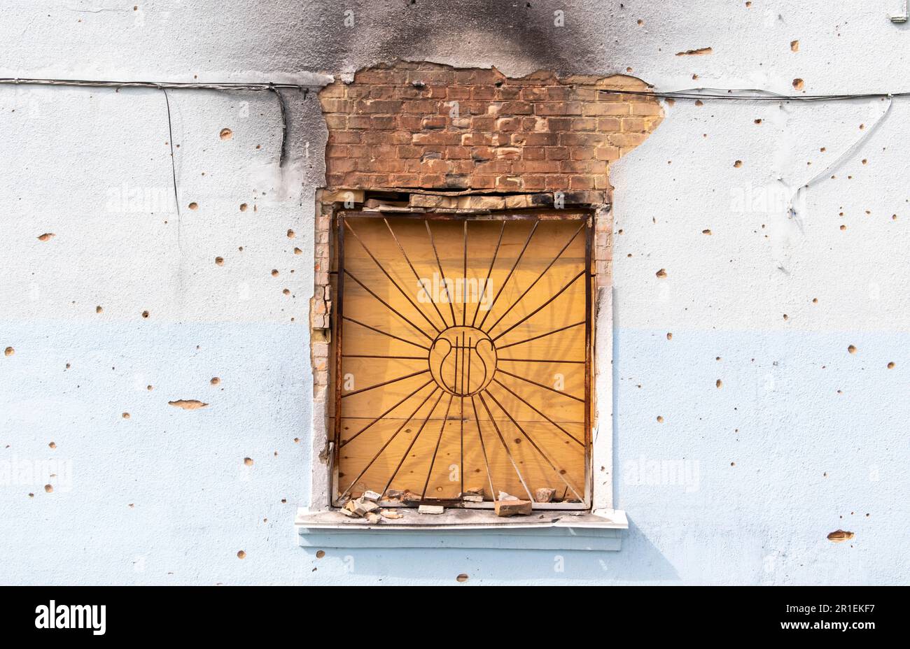 The buildings were hit by shelling. Boarded up windows and damaged ...