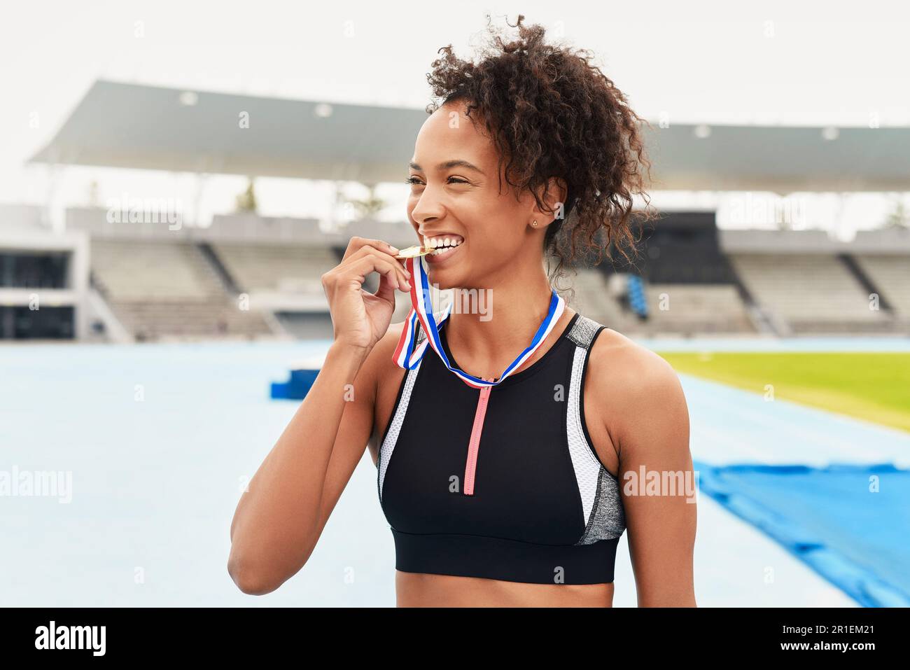Its a dream come true. an attractive young female athlete posing with ...