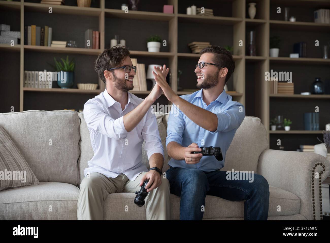Two brothers playing video game hi-res stock photography and images - Alamy