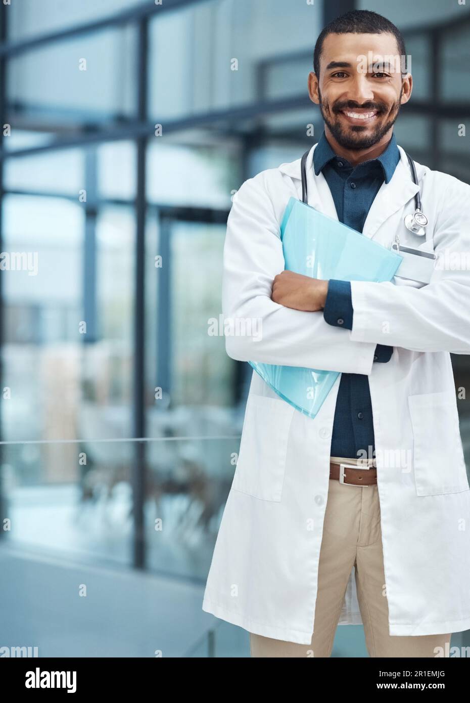 I have a passion for patient care. Portrait of a young doctor holding a ...