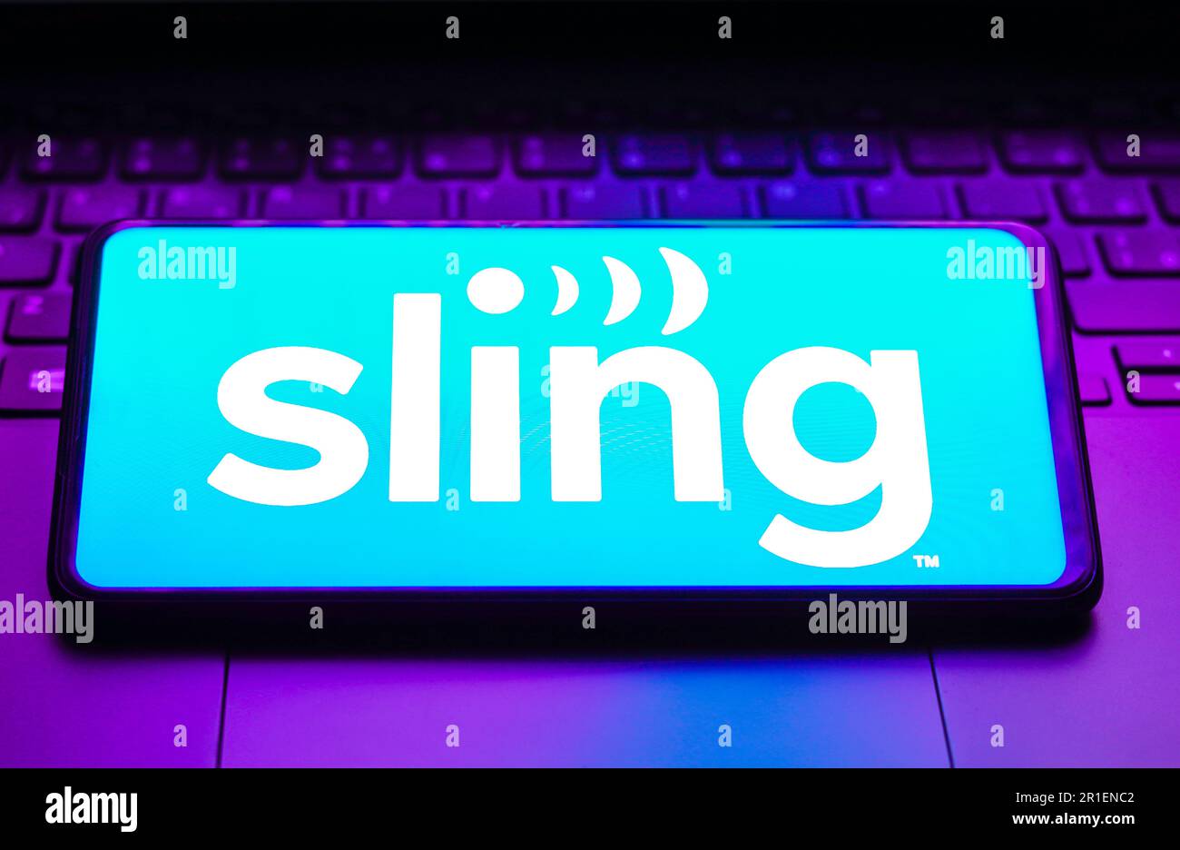 In this photo illustration, the Sling TV logo is displayed on a ...