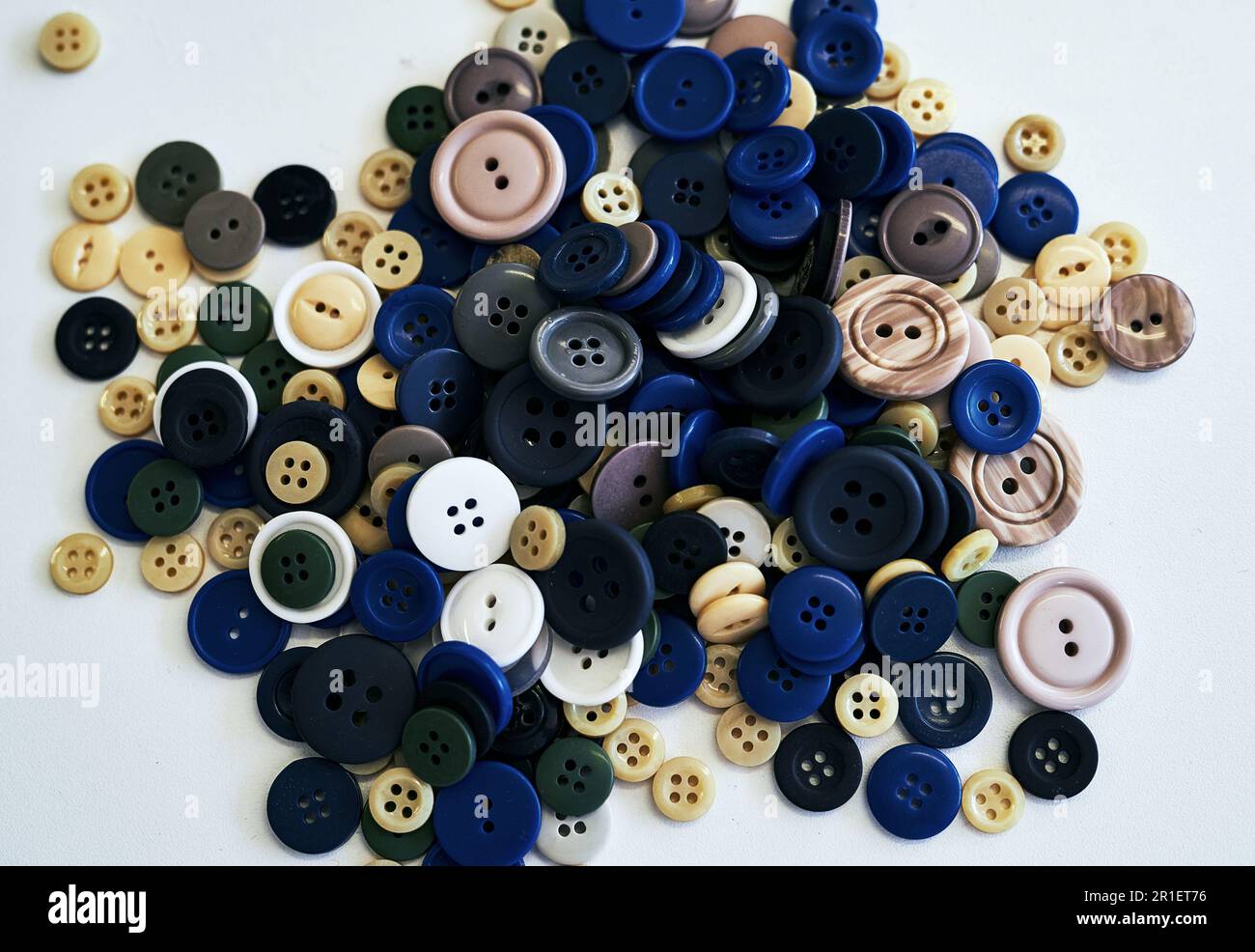 For the love of buttons. sewing buttons laying on a white background ...