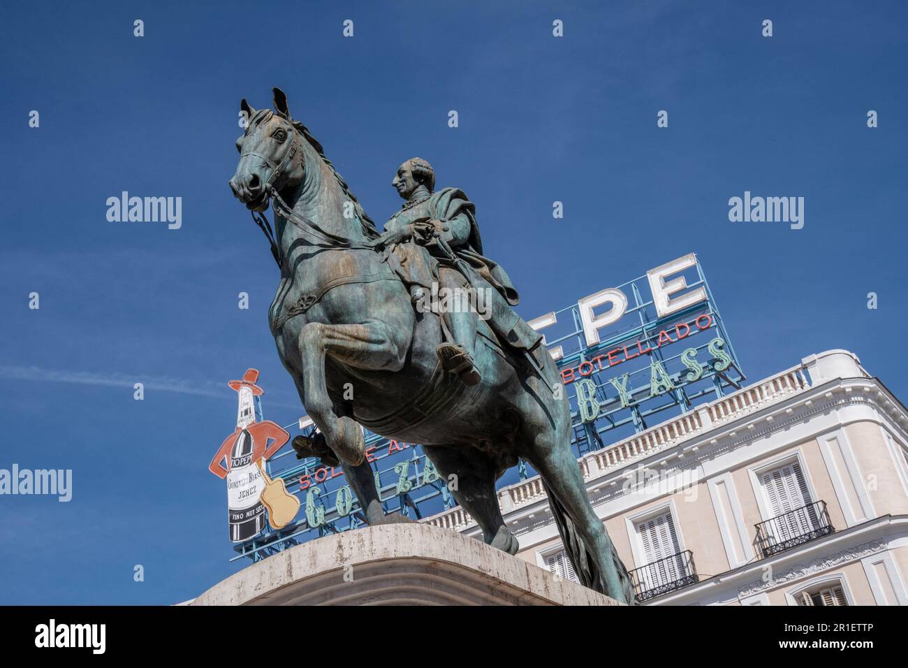 The statue of Charles III of Spain and the Tio Pepe sign in Puerta del ...