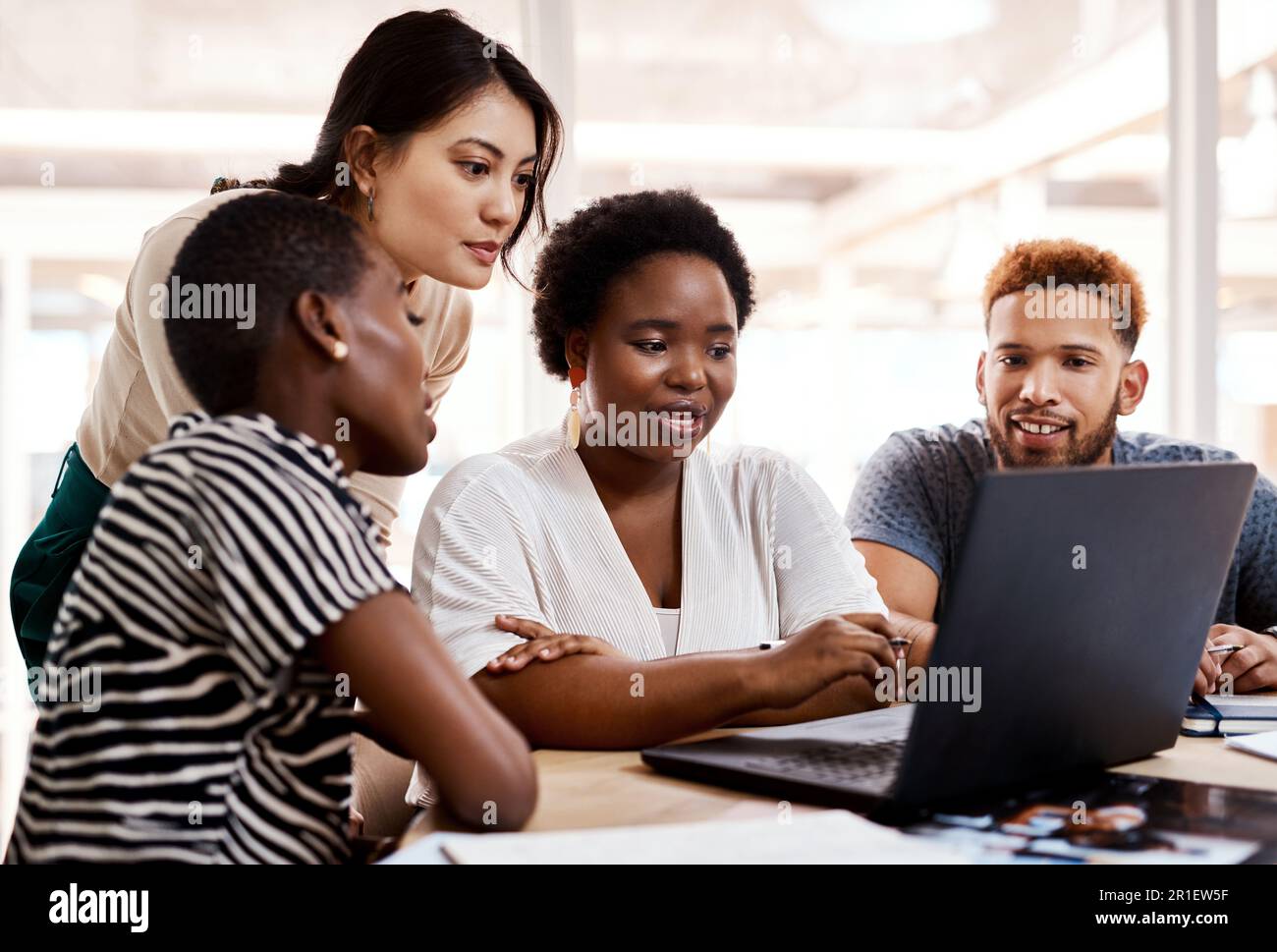 Coming up with unique and useful ideas. a group of young creatives ...