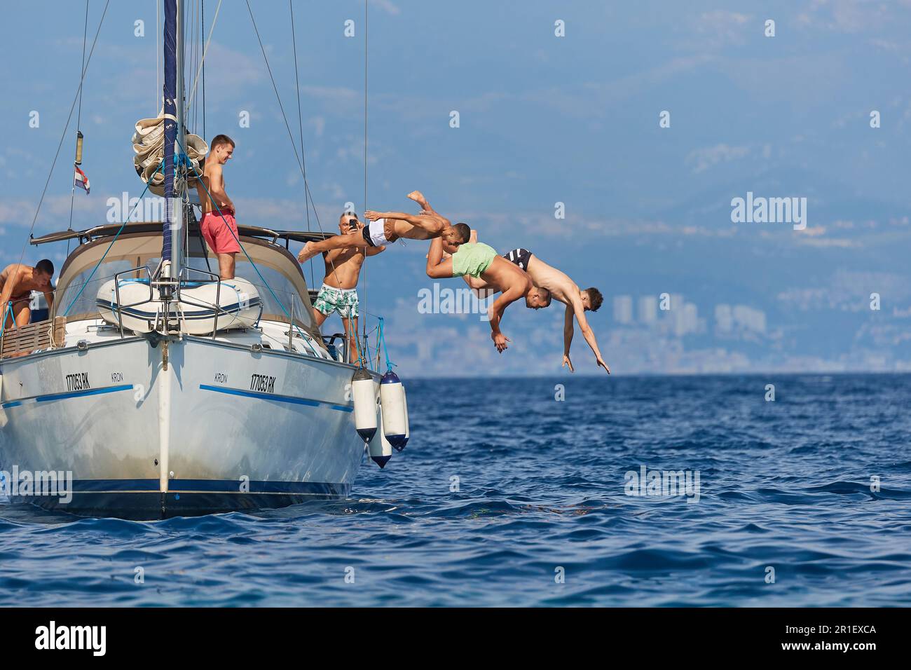 People jumping from a boat to the sea Stock Photo - Alamy