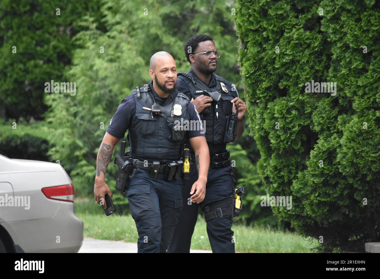 Prince George's County Police Officer's walk around the area and search ...