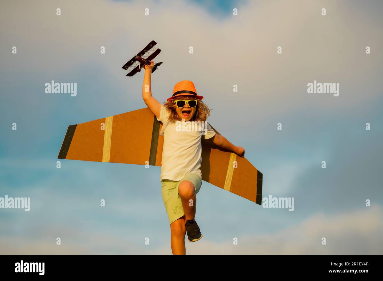 Child playing. Dream of flying. Little children with toy airplane in a ...