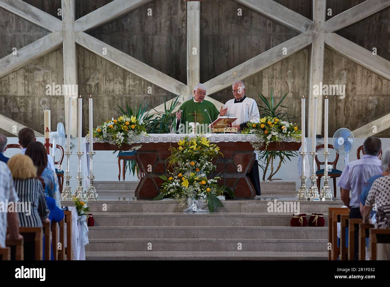 Ceremony in a church, priests holding mass Stock Photo - Alamy