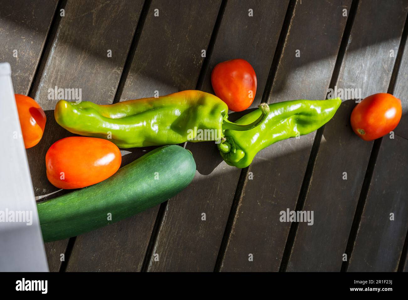 A few fresh assorted vegetables lying on the floor Stock Photo - Alamy