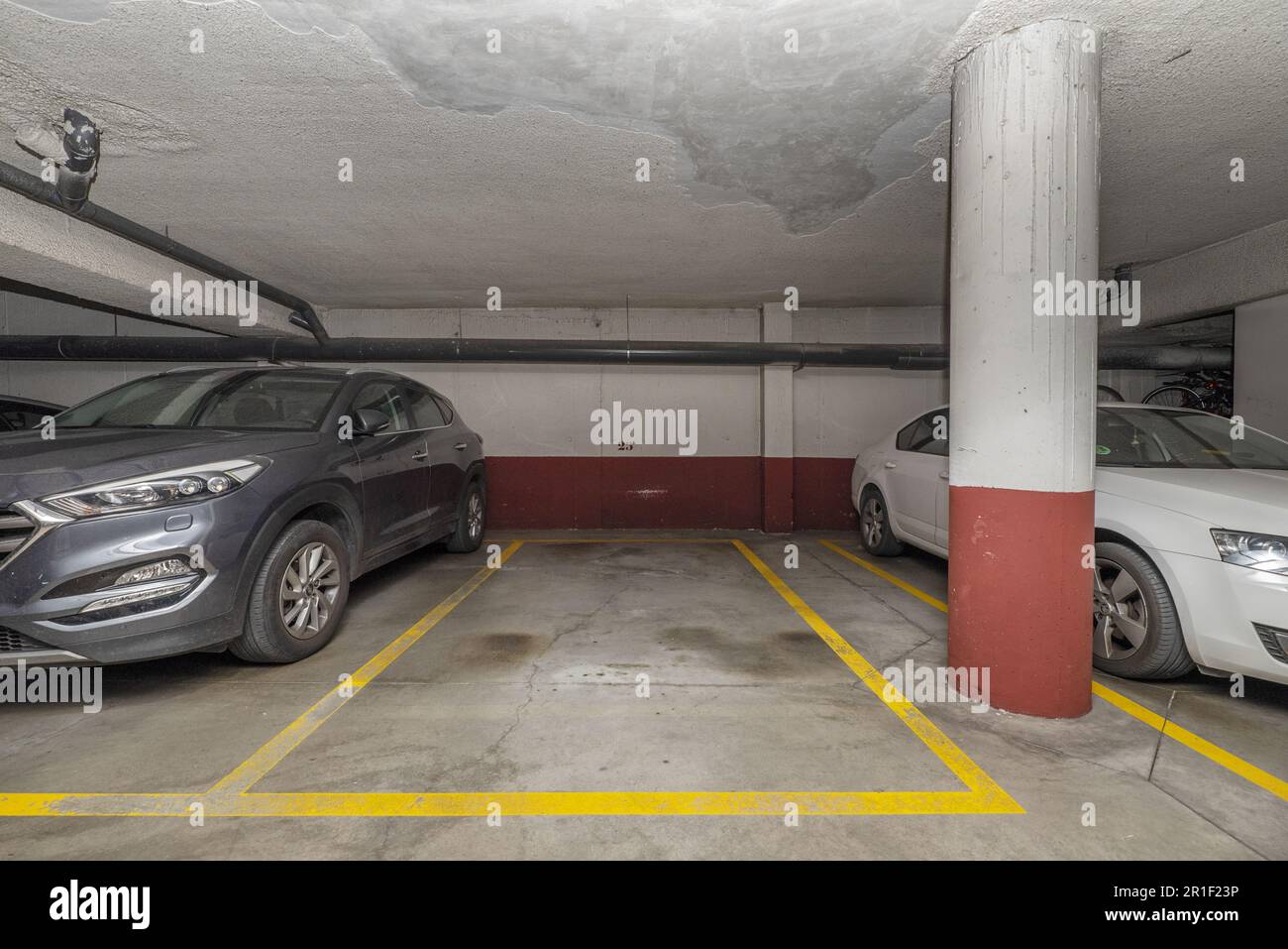 Some parking spaces in an urban residential apartment building with ...