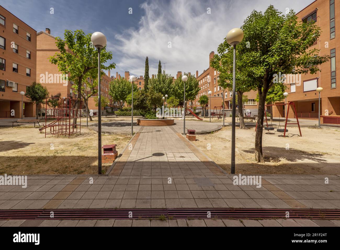 Facades of urban residential buildings with interior gardens with trees ...