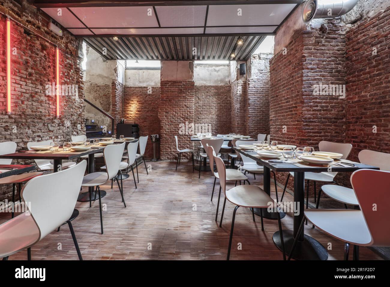 Room of a restaurant with brick walls without rendering with Wooden ...