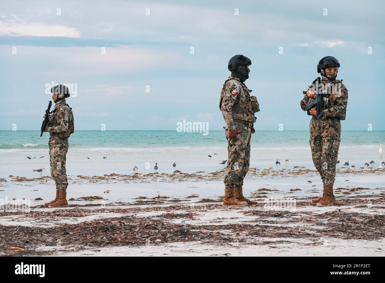 Mexican army soldiers and police conduct an operation on a beach at a ...
