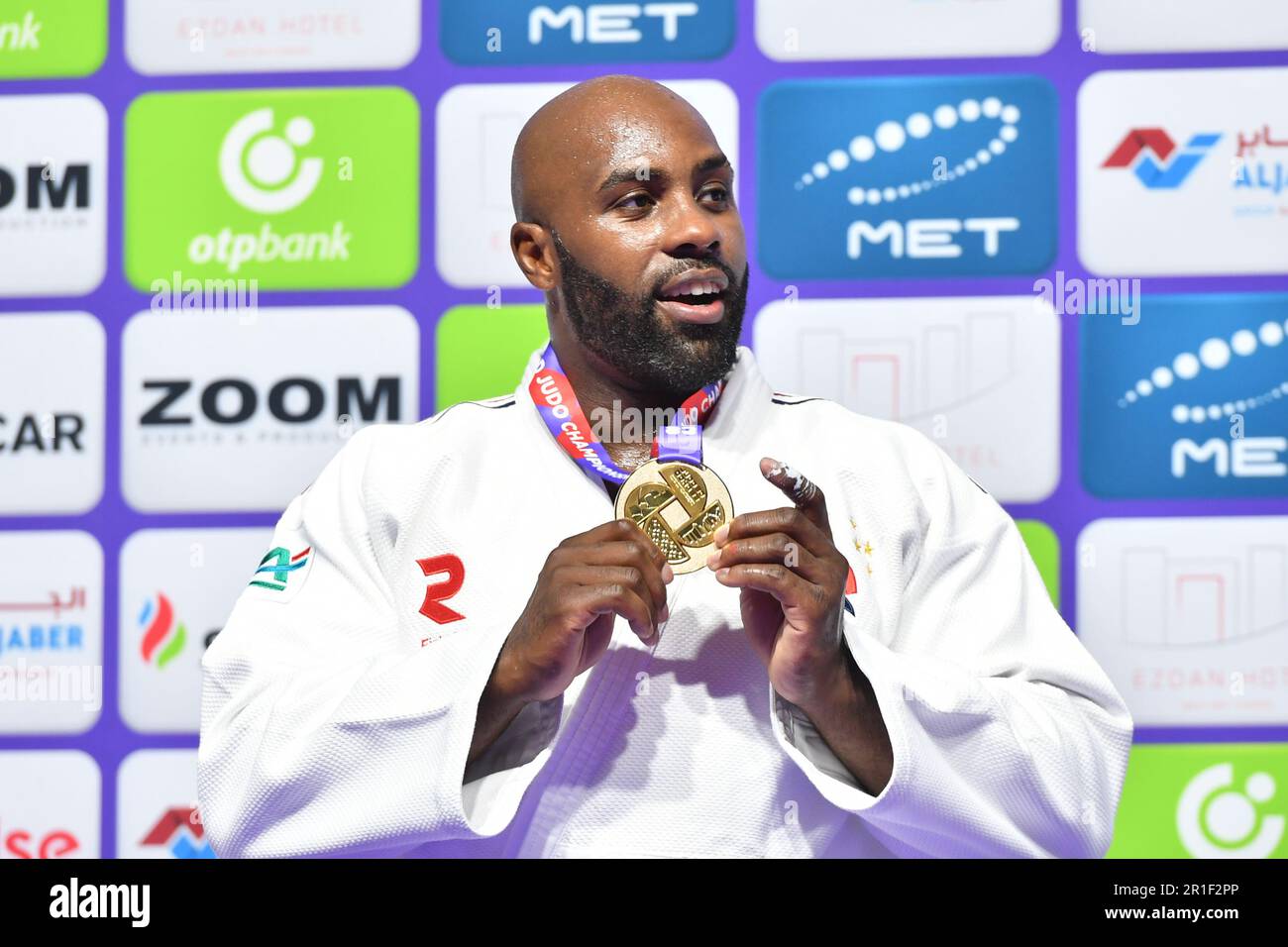 France's Teddy Riner poses with the gold medal after winning the men's ...