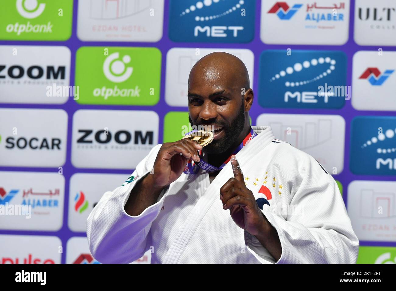 France's Teddy Riner poses with the gold medal after winning the men's ...