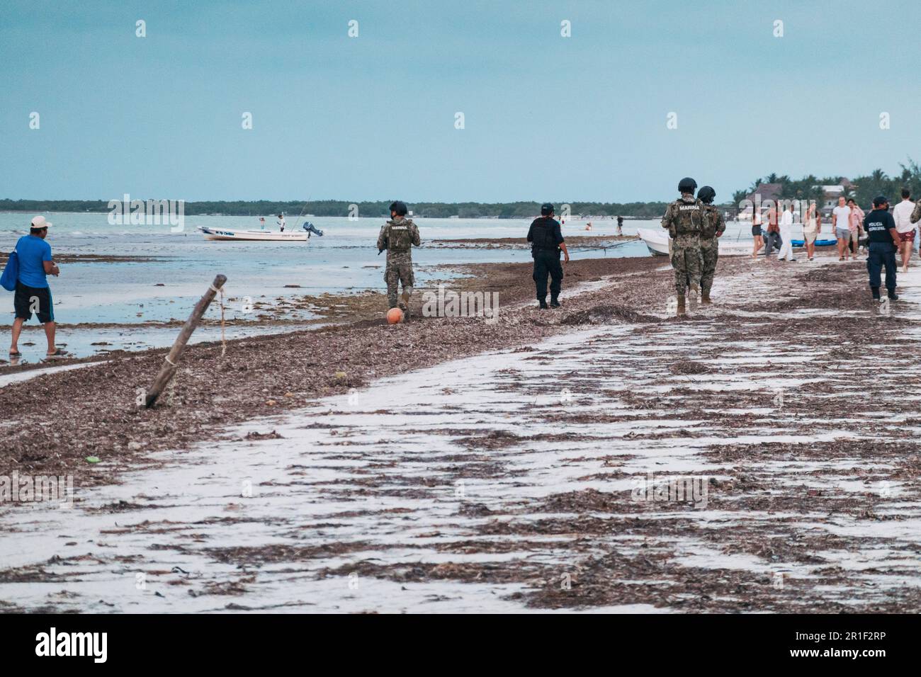 Mexican army soldiers and police conduct an operation on a beach at a ...