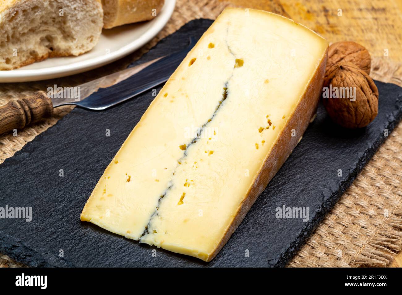 Cheese collection, French Morbier semi-soft cow milk cheese with black ...