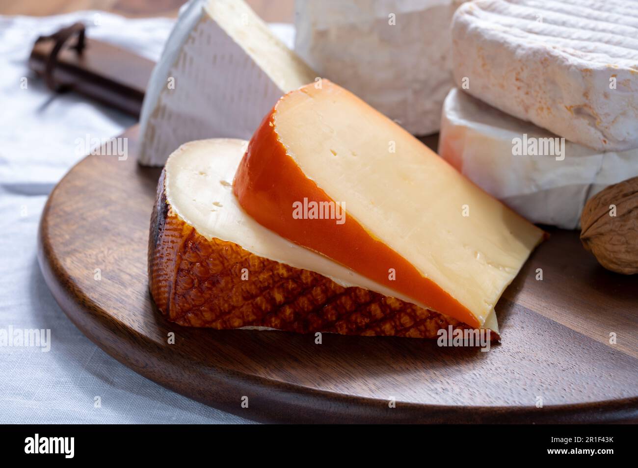 Collection of Belgian cheeses, soft yellow cow milk cheese with white ...
