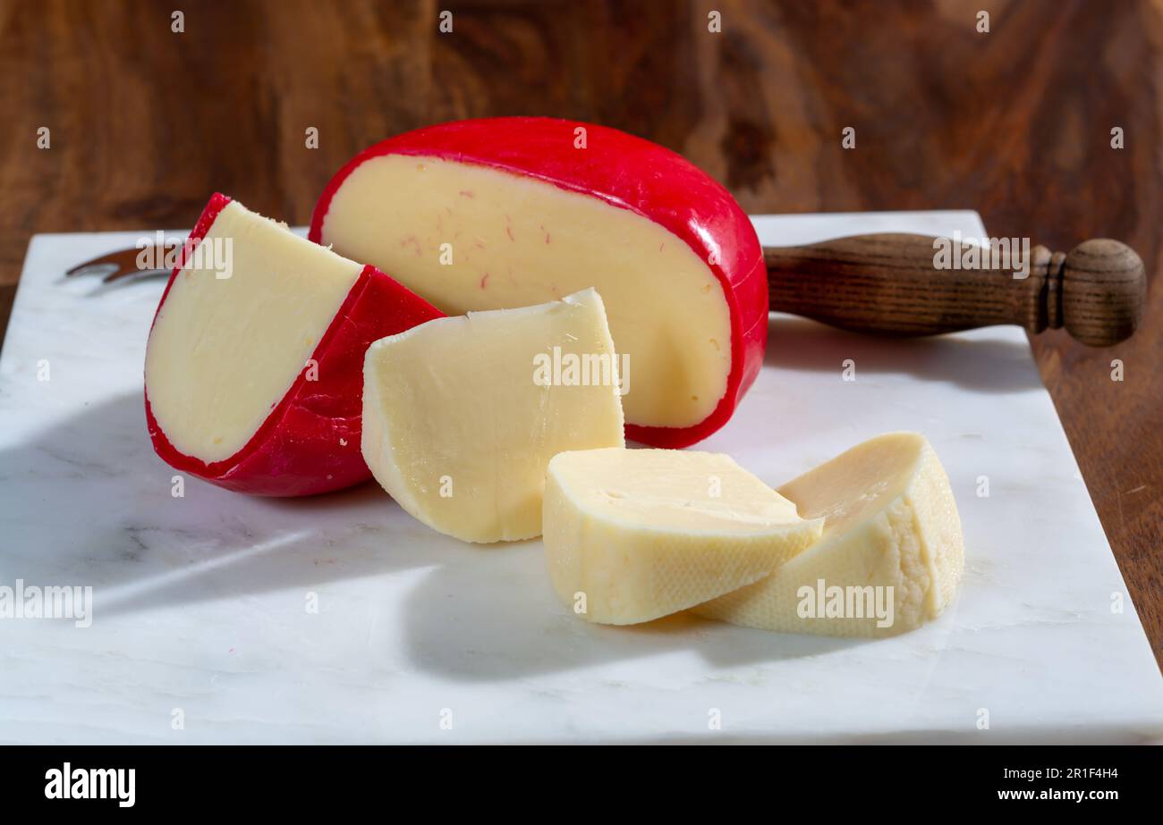 British red waxed original cheddar cheese madse from cow milk close up ...