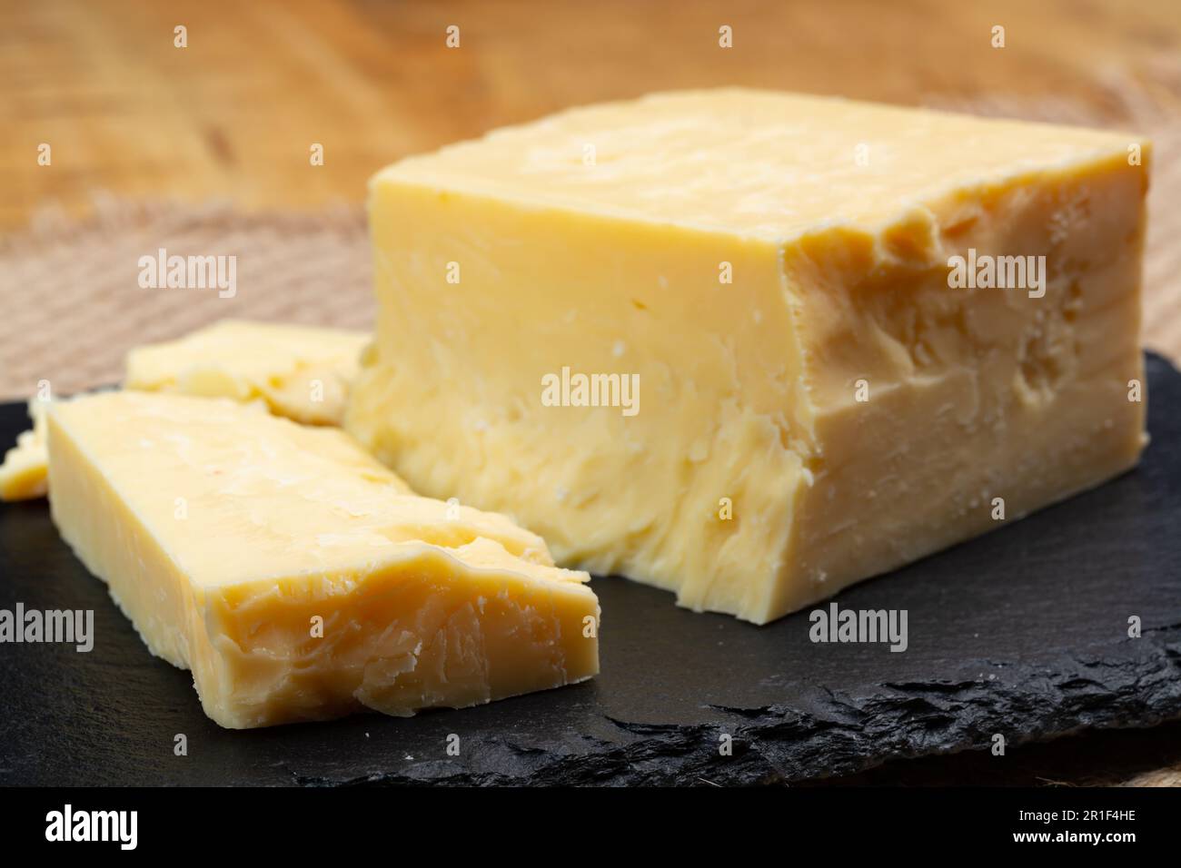 British cheeses collection, English matured smoked cheddar cheese close ...