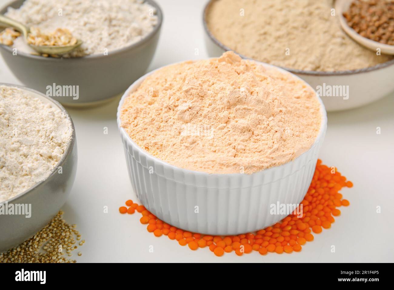 Different types of flour on white table, closeup Stock Photo - Alamy