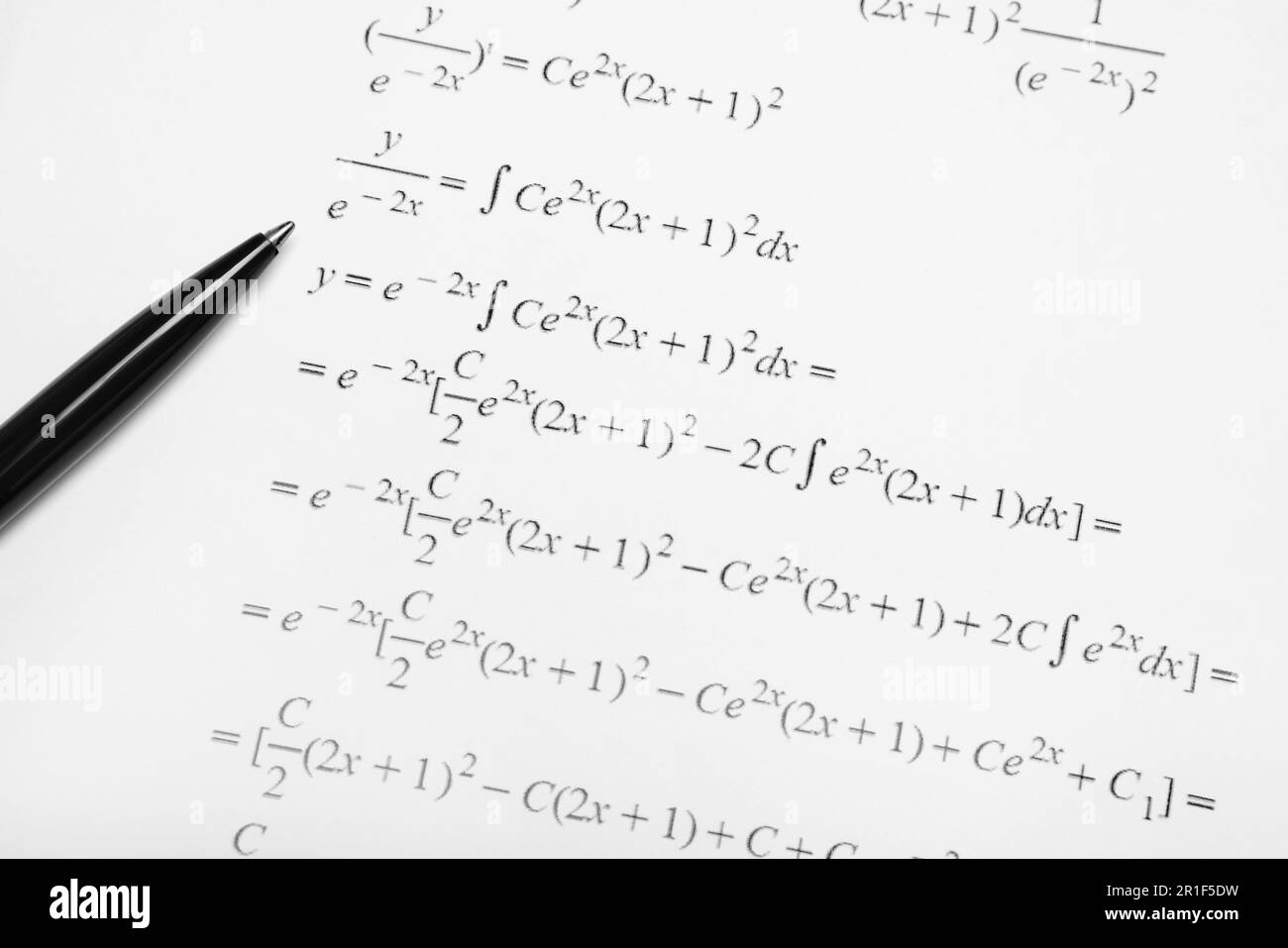 Sheet of paper with mathematical formulas and pen Stock Photo - Alamy