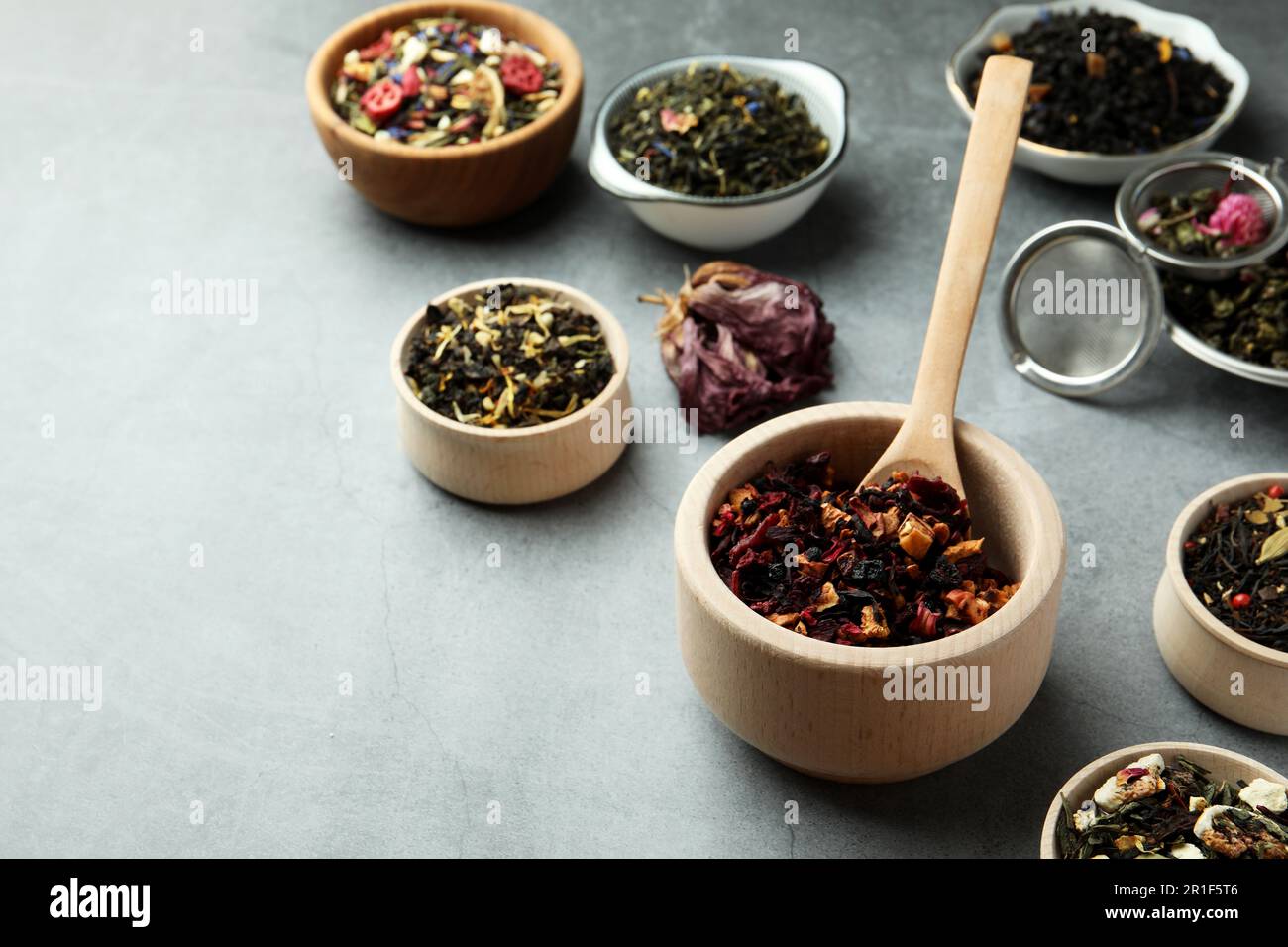 Many different herbal teas on grey table Stock Photo - Alamy