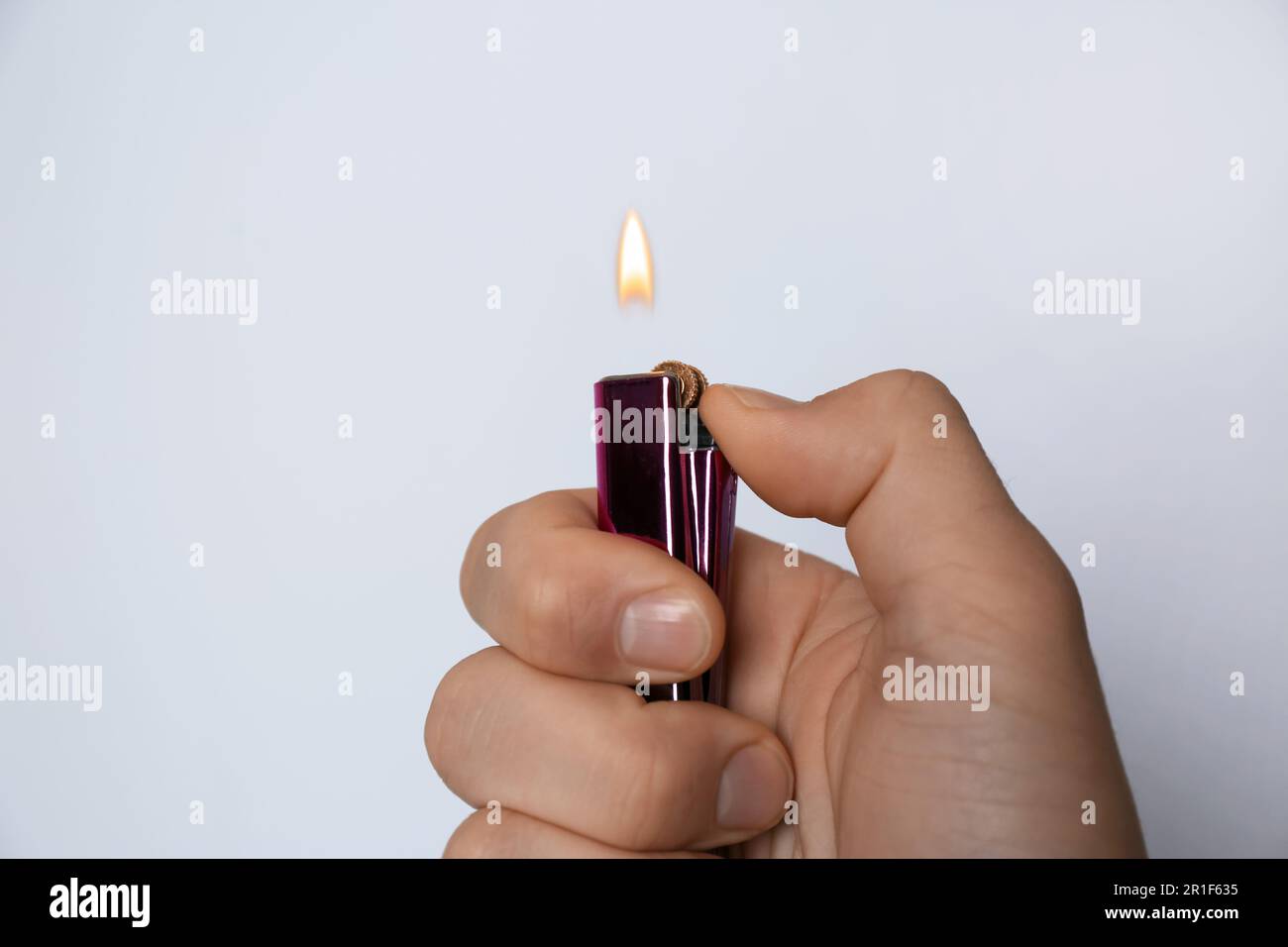 Man holding lighter on white background, closeup Stock Photo - Alamy