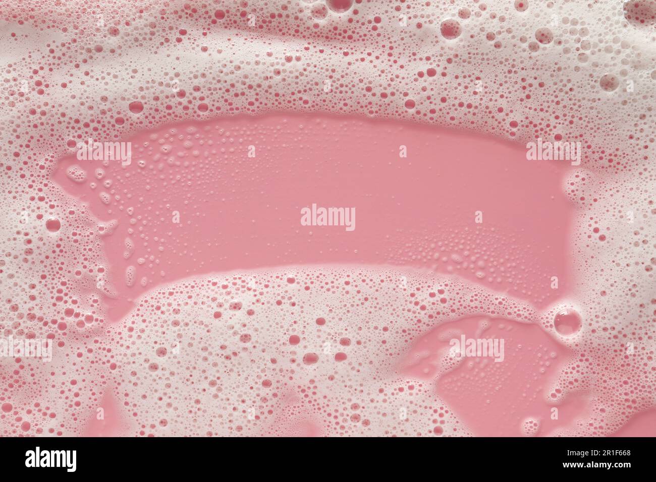 White washing foam on pale pink background, top view Stock Photo - Alamy