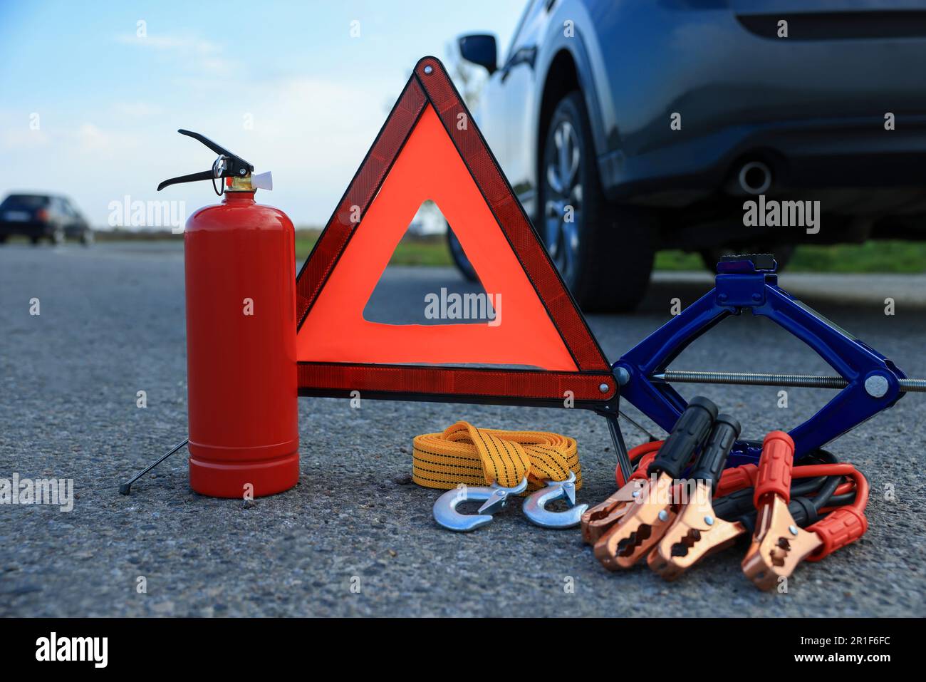 Emergency warning triangle and car safety equipment outdoors Stock ...