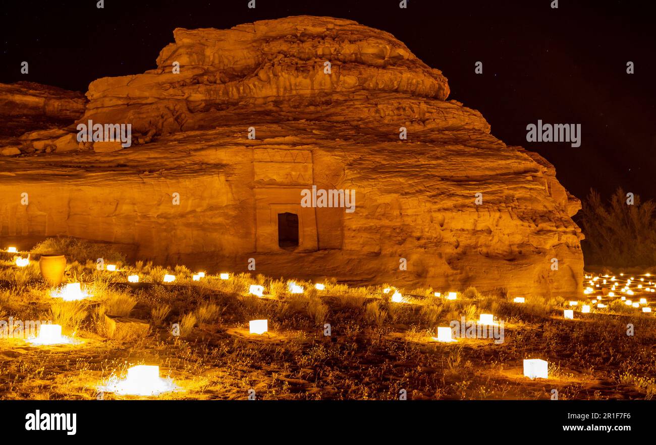 Ancient tombs of Hegra city illuminated during the night, Al Ula, Saudi ...
