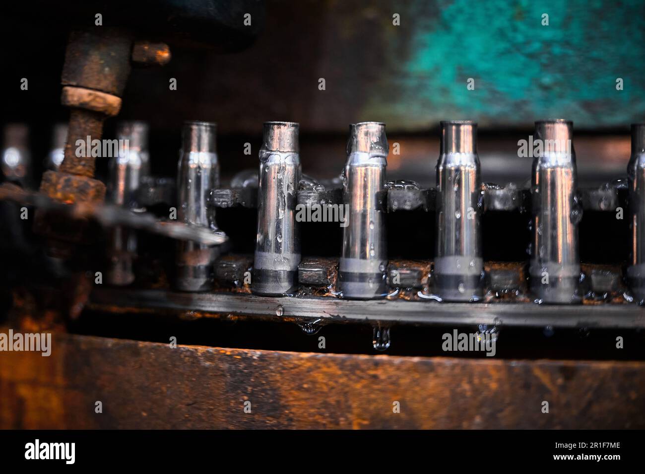 Shell casings transported by vintage equipment at plant Stock Photo - Alamy